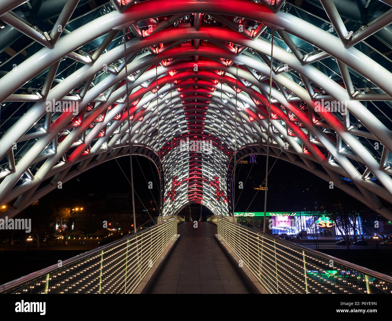 Peace of Bridge illuminated by night, Tbilisi, Georgia Stock Photo - Alamy