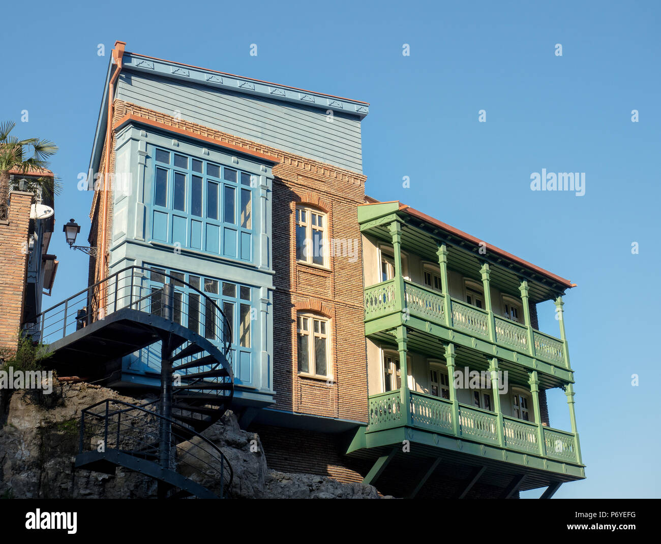 Colorful traditional houses on a rocky cliff, Tbilisi, Georgia Stock ...