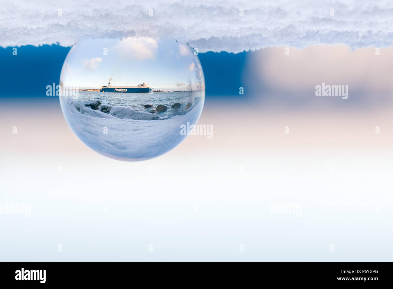 Cargo ship shot through glass ball on winter Stock Photo - Alamy