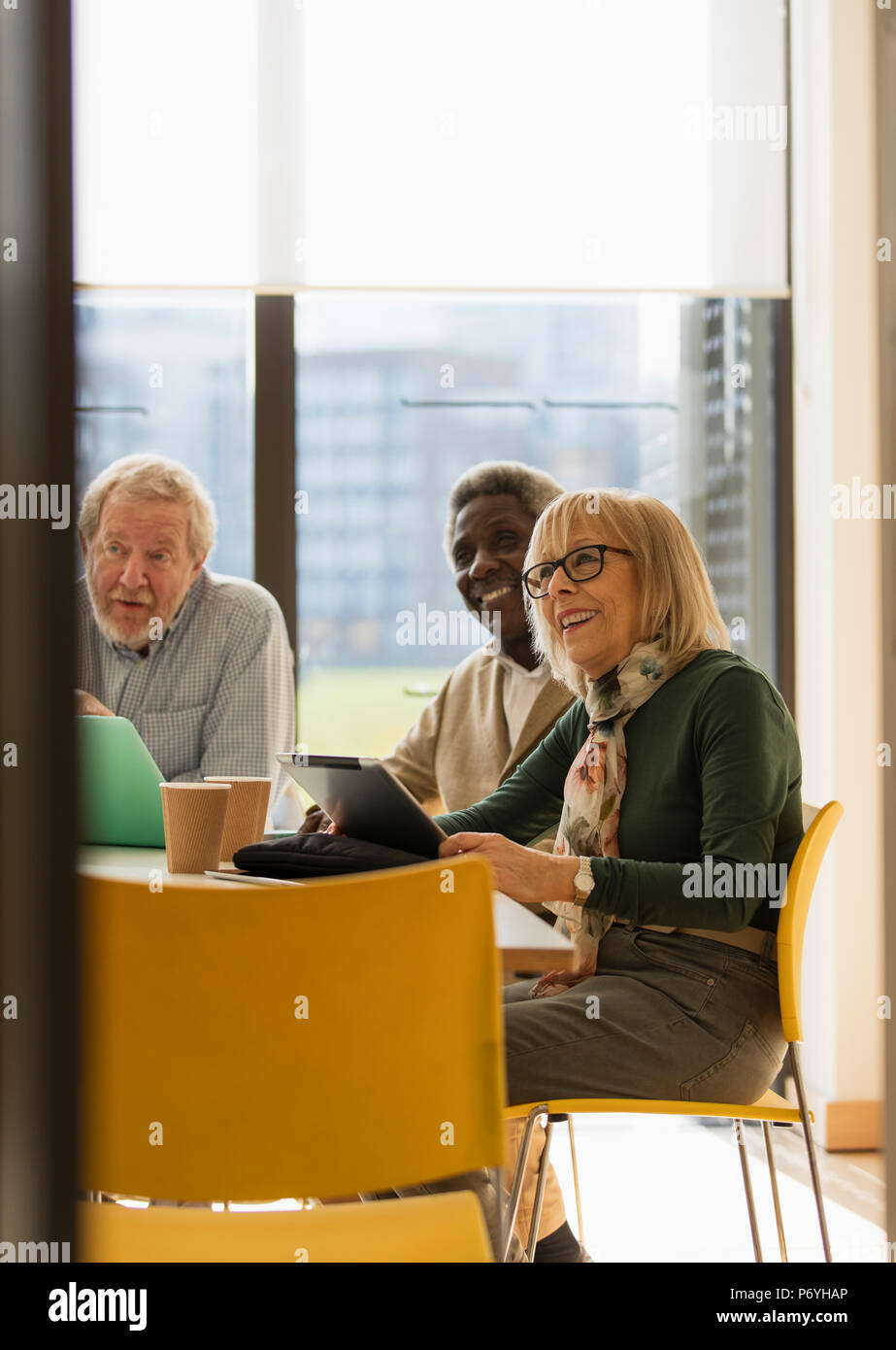 Smiling business people in conference room meeting Stock Photo - Alamy