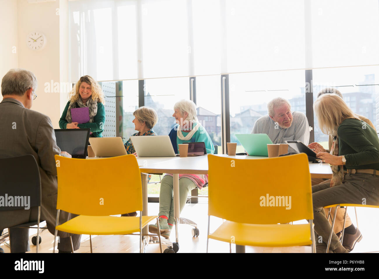 Senior business people in conference room meeting Stock Photo - Alamy