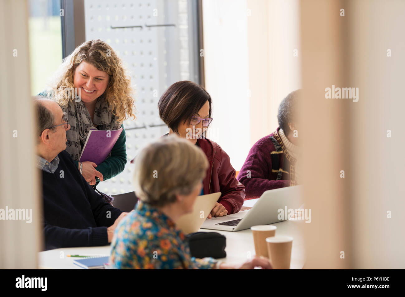 Smiling business people in conference room meeting Stock Photo - Alamy