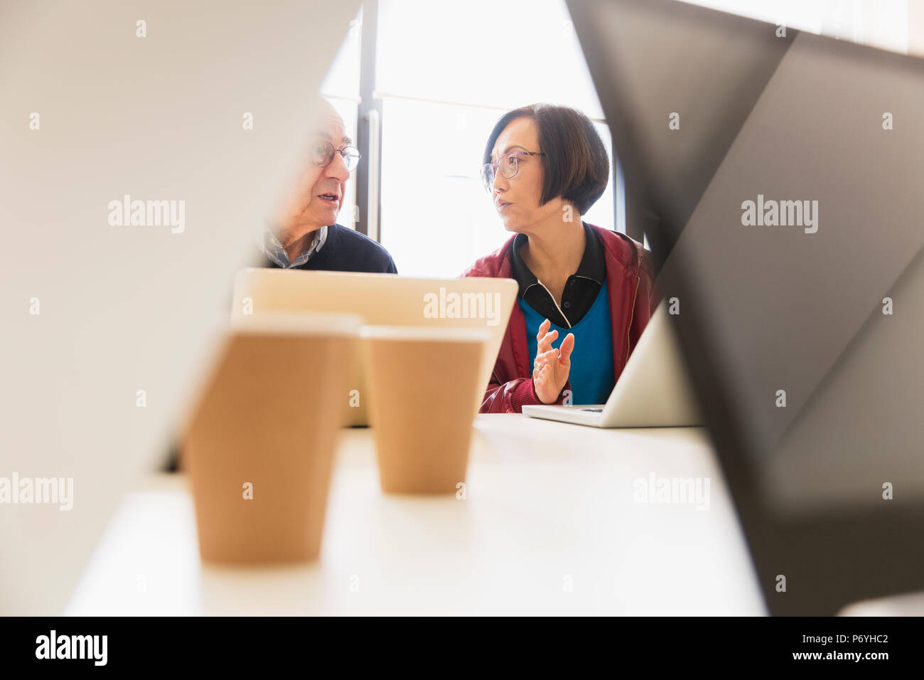 Business people talking, using laptops in conference room meeting Stock ...