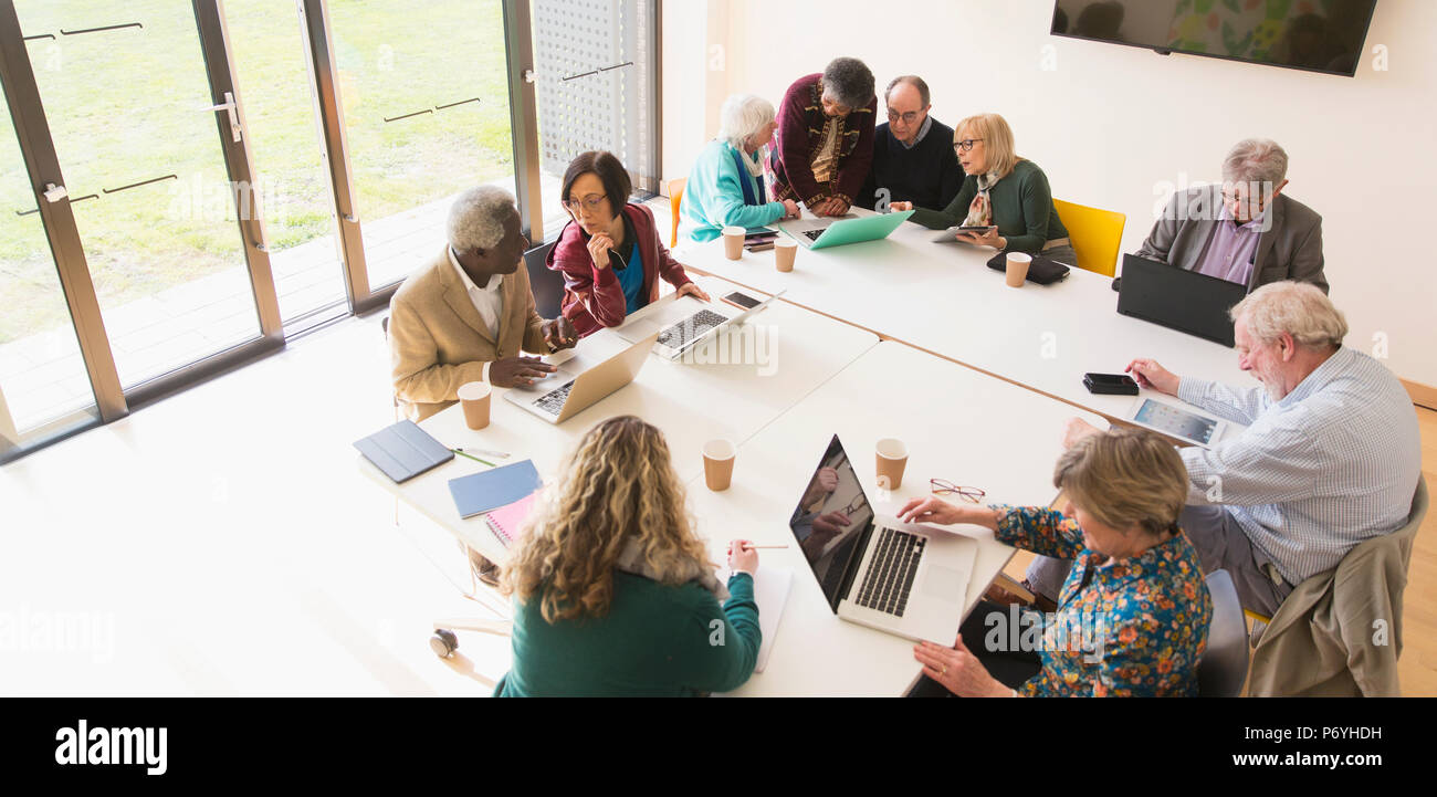 Senior business people in conference room meeting Stock Photo - Alamy