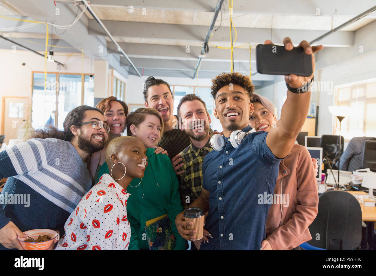 Creative business team taking selfie in office Stock Photo - Alamy
