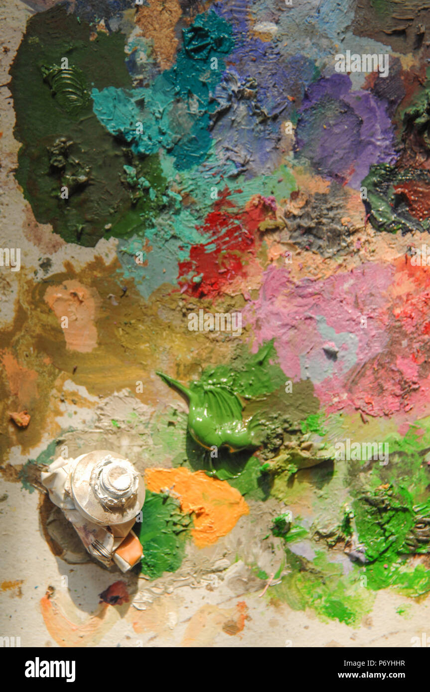 mixed multi colored paint and a tube. top view. concept: artistic and ...
