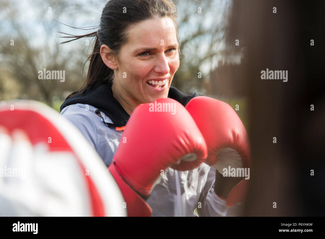 Determined woman boxing Stock Photo - Alamy