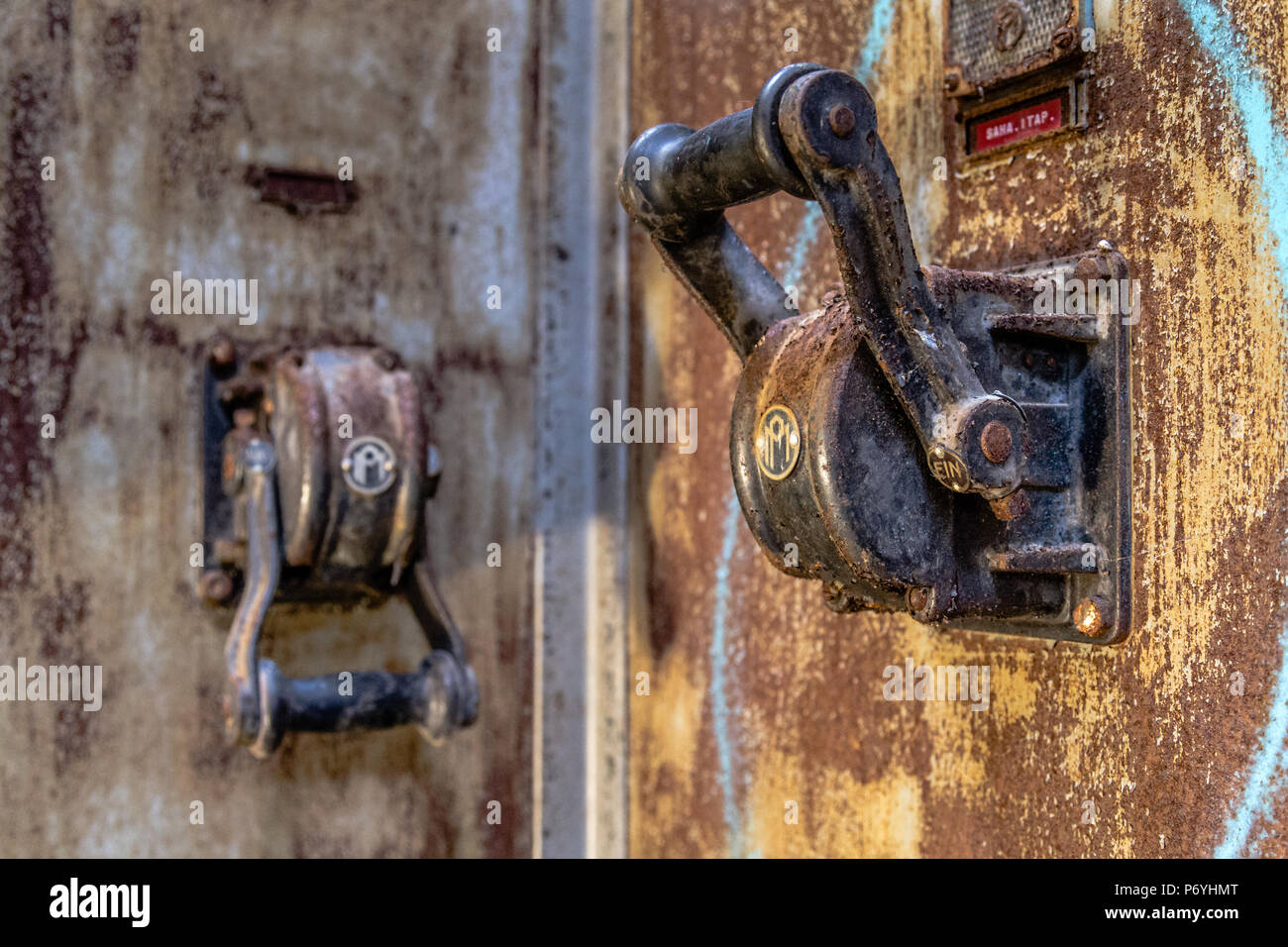 Two sturdy and rusty machine levers in old abandoned factory Stock ...