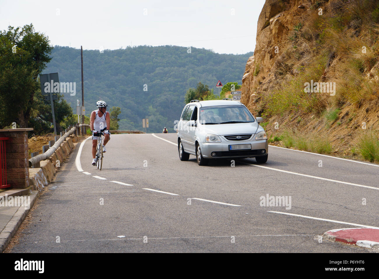 Giving a cyclist 1.5m-plus clear overtaking space. Girona, Catalonia ...