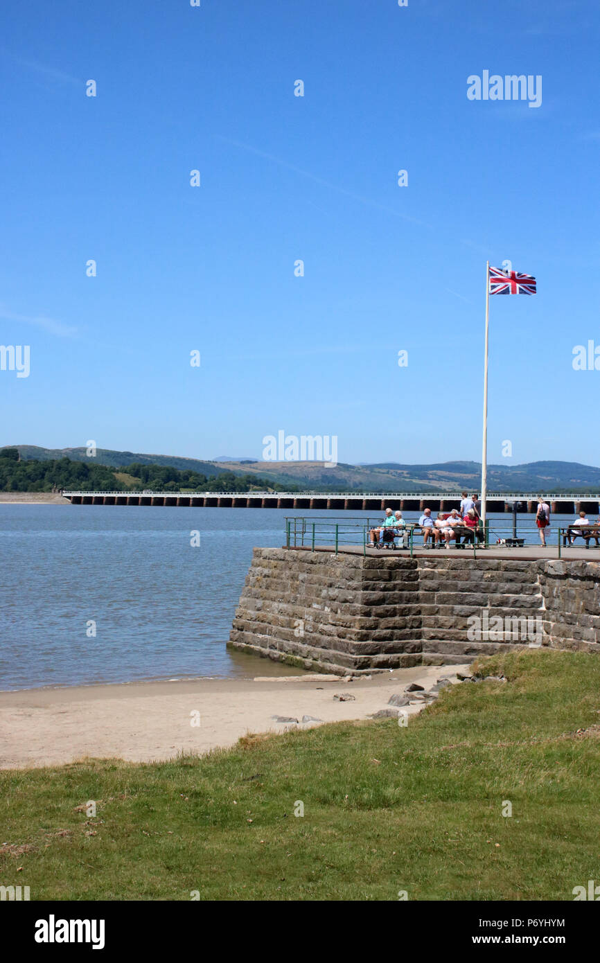People on Arnside Pier by the River Kent estuary as the tide comes in ...