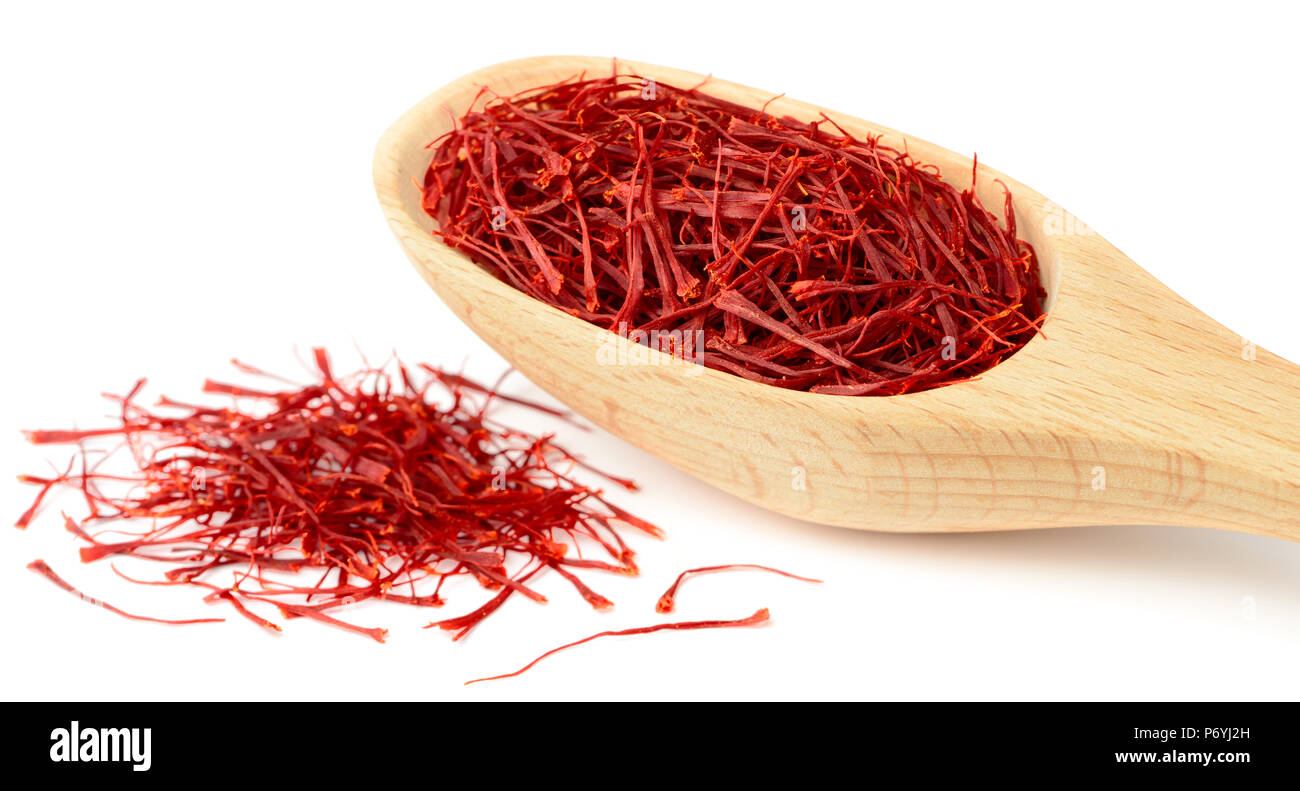 saffron thread in the wooden spoon, isolated on white background Stock ...