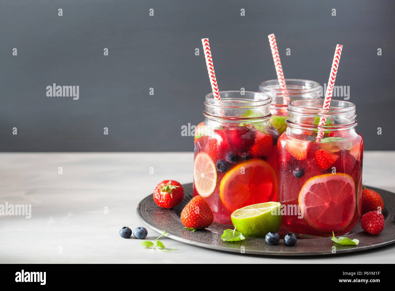 summer berry lemonade with lime and mint in mason jar Stock Photo - Alamy