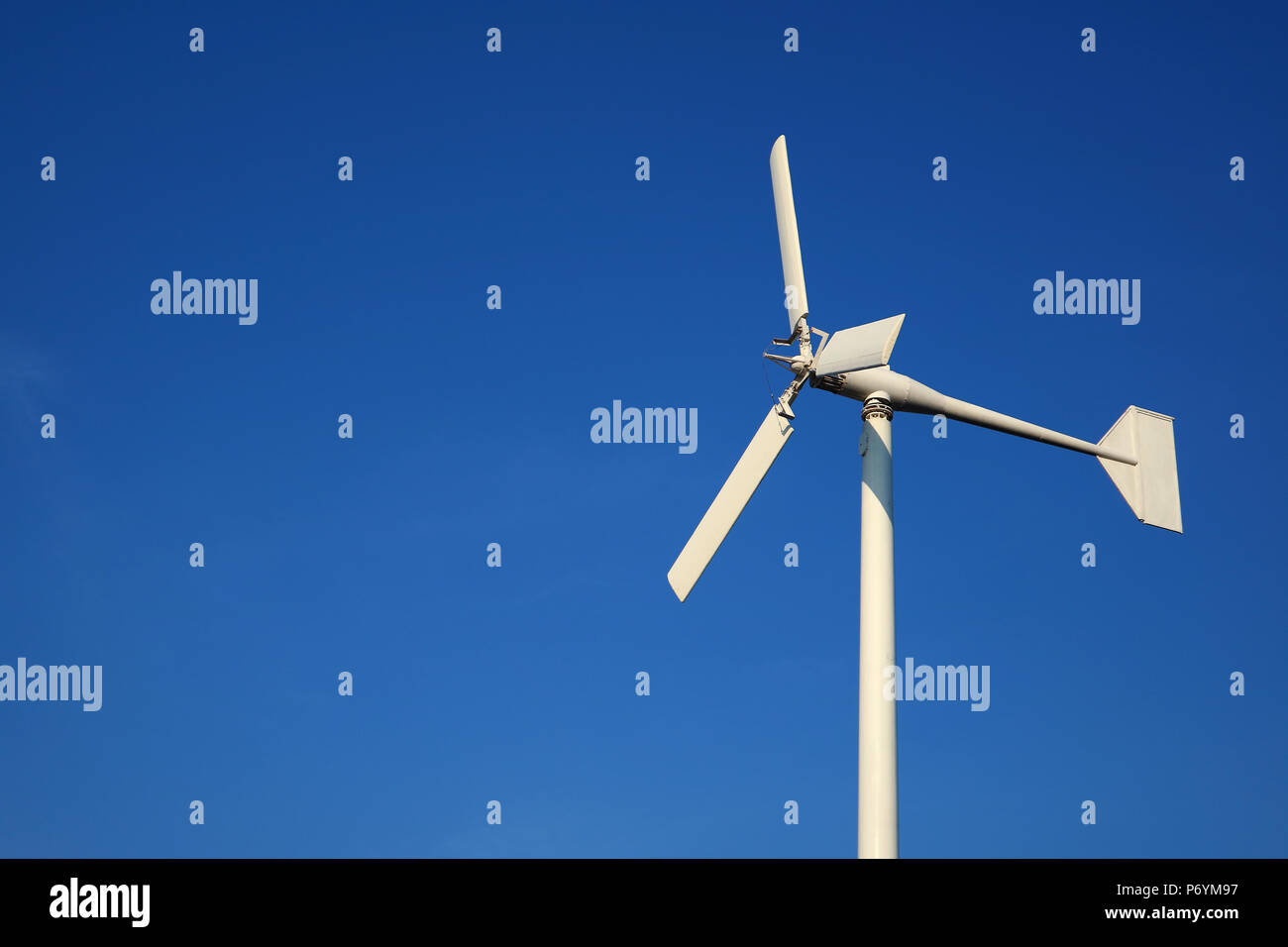 Wind turbine against bright blue hi-res stock photography and images ...