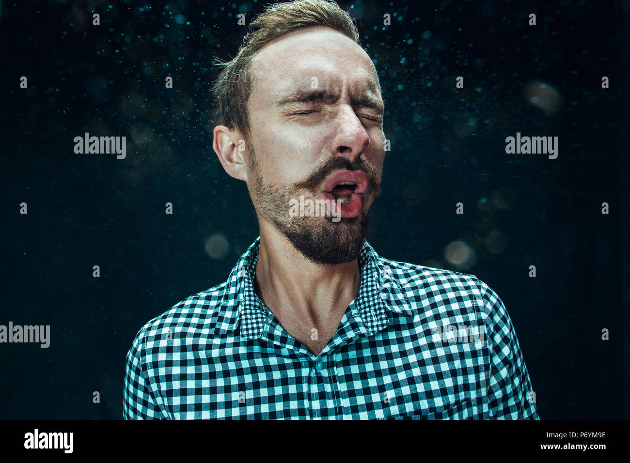 Sneezing young male hi-res stock photography and images - Alamy