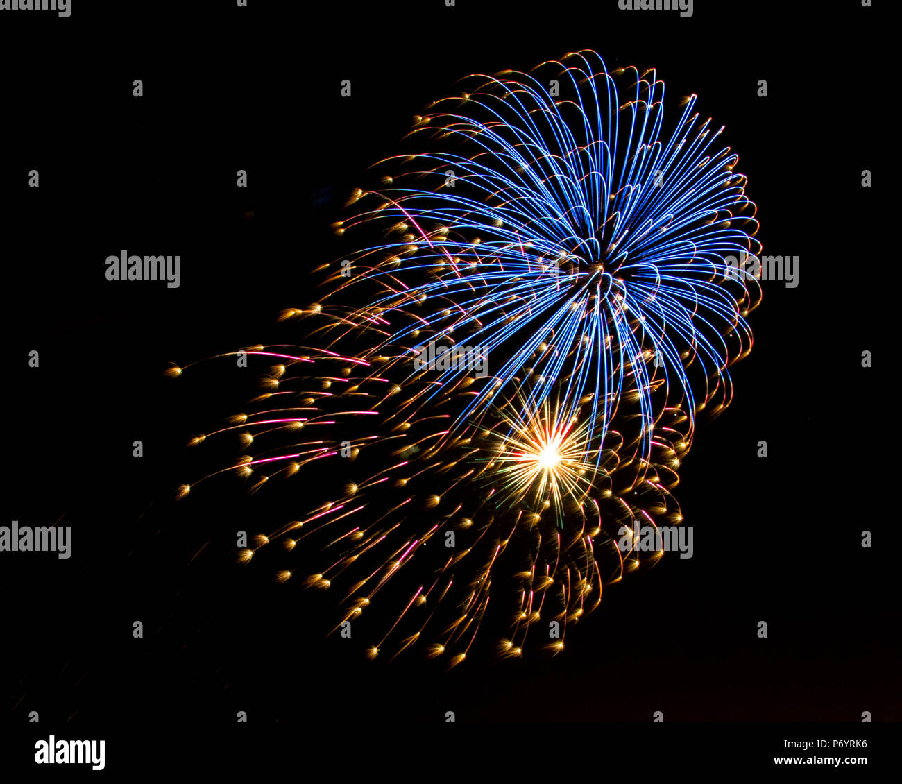 Blue Fireworks burst predominates this display of 4 bursts Stock Photo ...