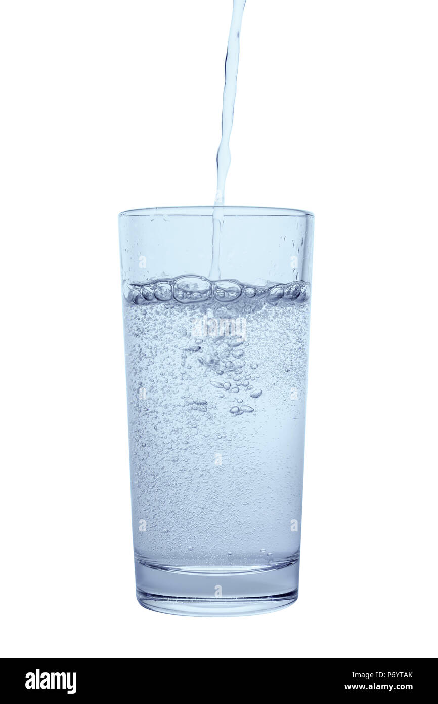pouring mineral water in transparent glass with drops and bubbles ...