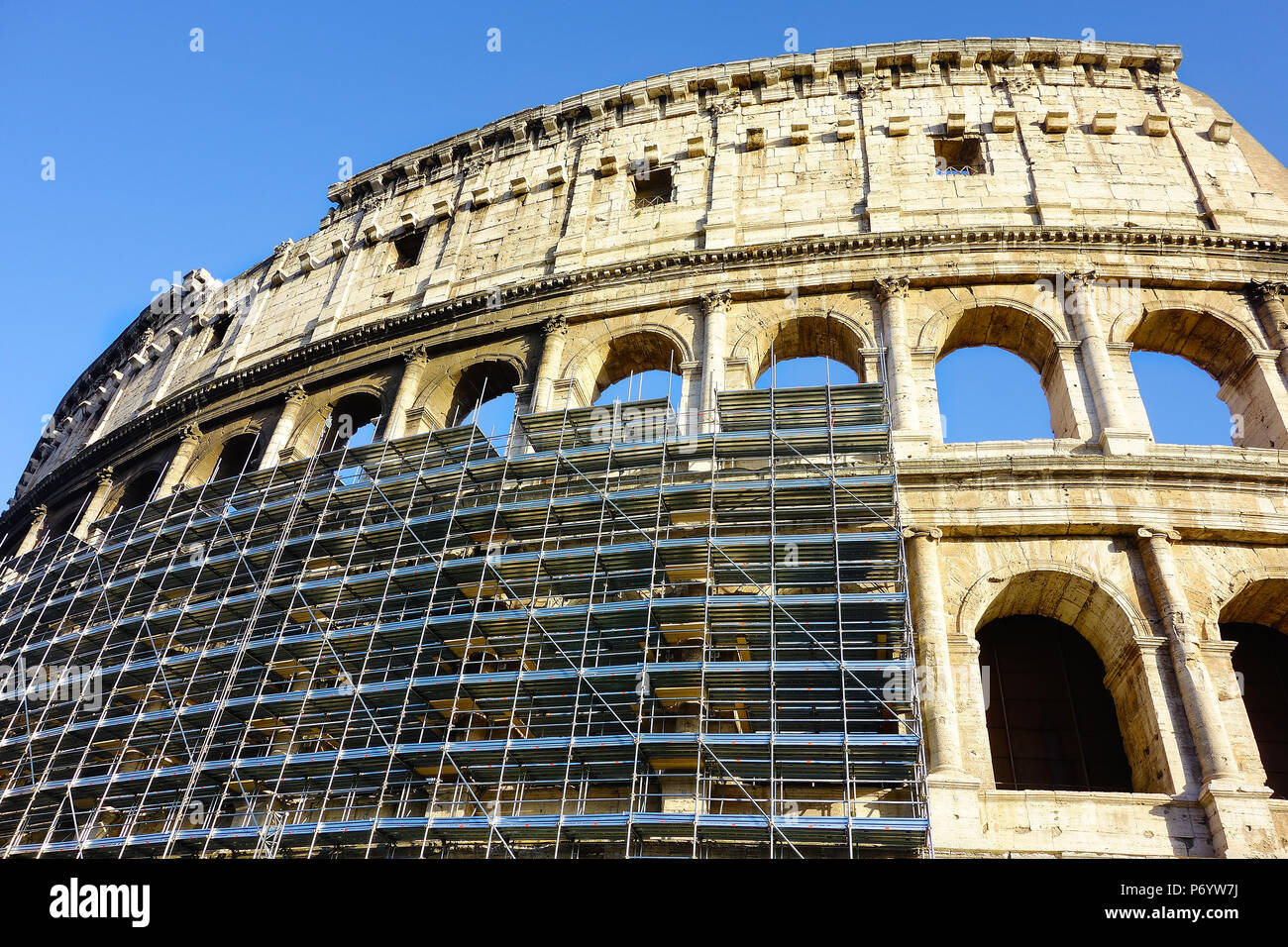 Daytime Closeup of the Colosseum or Coliseum covered in scaffolding for ...