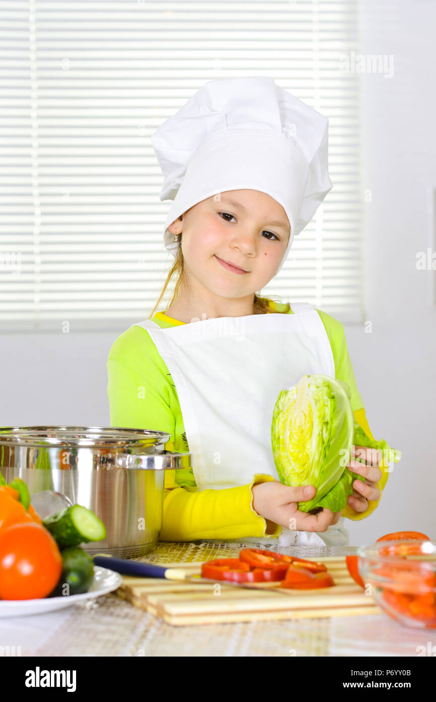 girl wearing chef uniform cooking Stock Photo - Alamy