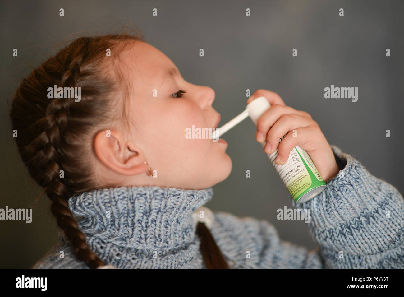 cute sick girl with spray Stock Photo - Alamy