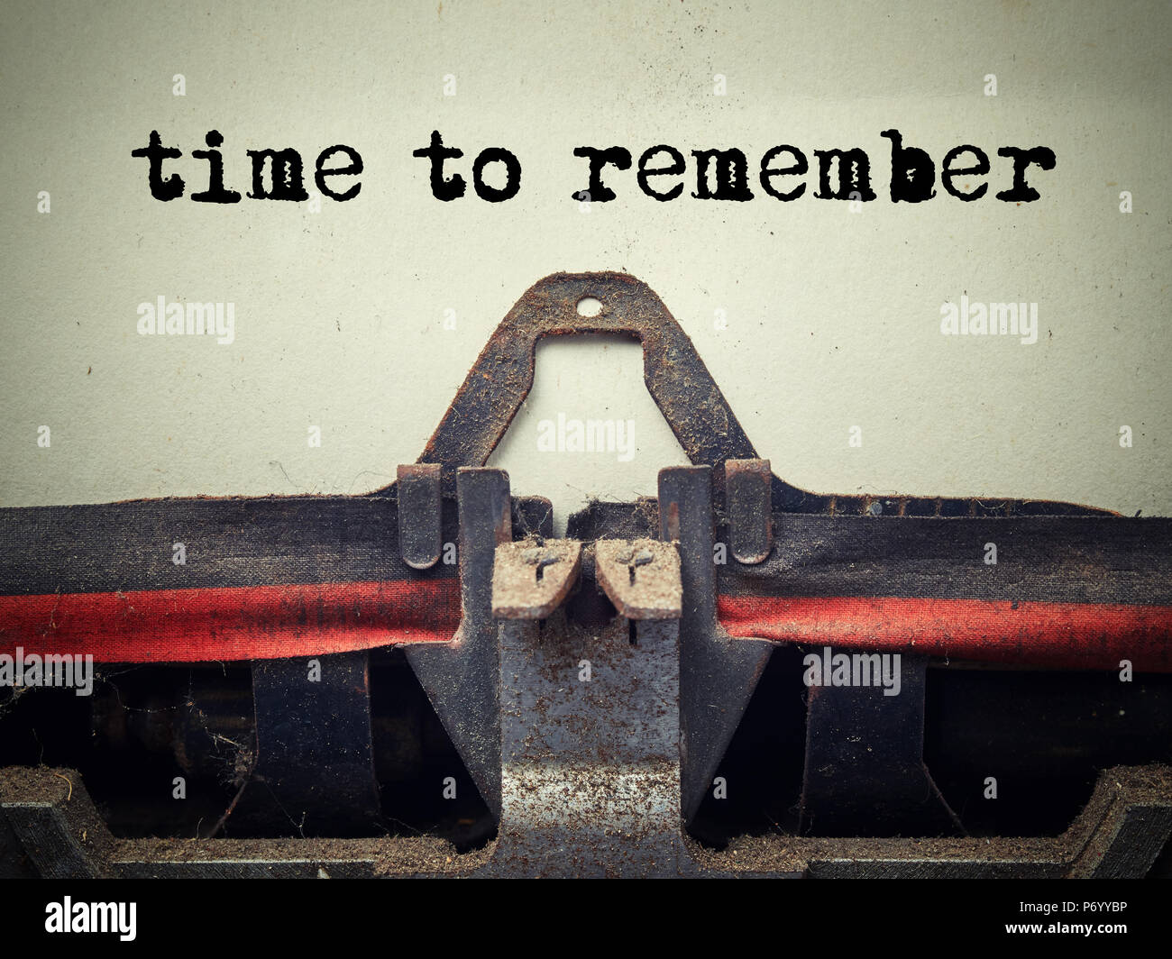 Close up of old typewriter covered with dust with time to remember text ...