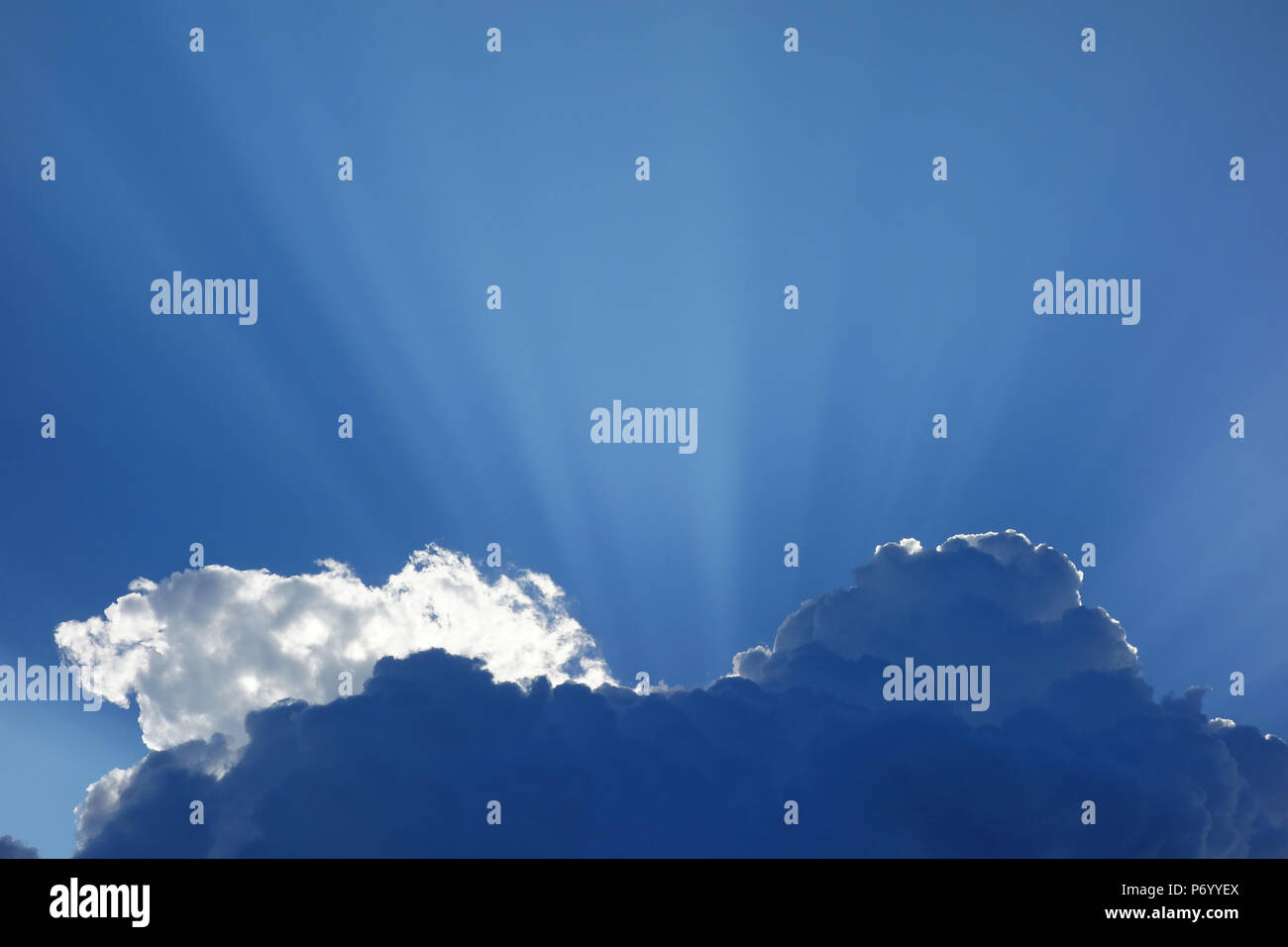 Rays of light coming out clouds in the sky Stock Photo - Alamy