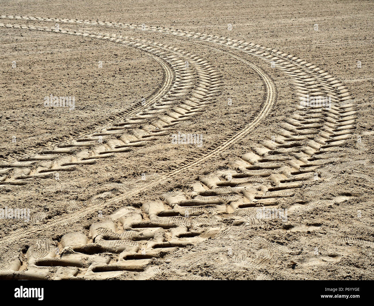 Tractor footprints field curve Stock Photo - Alamy