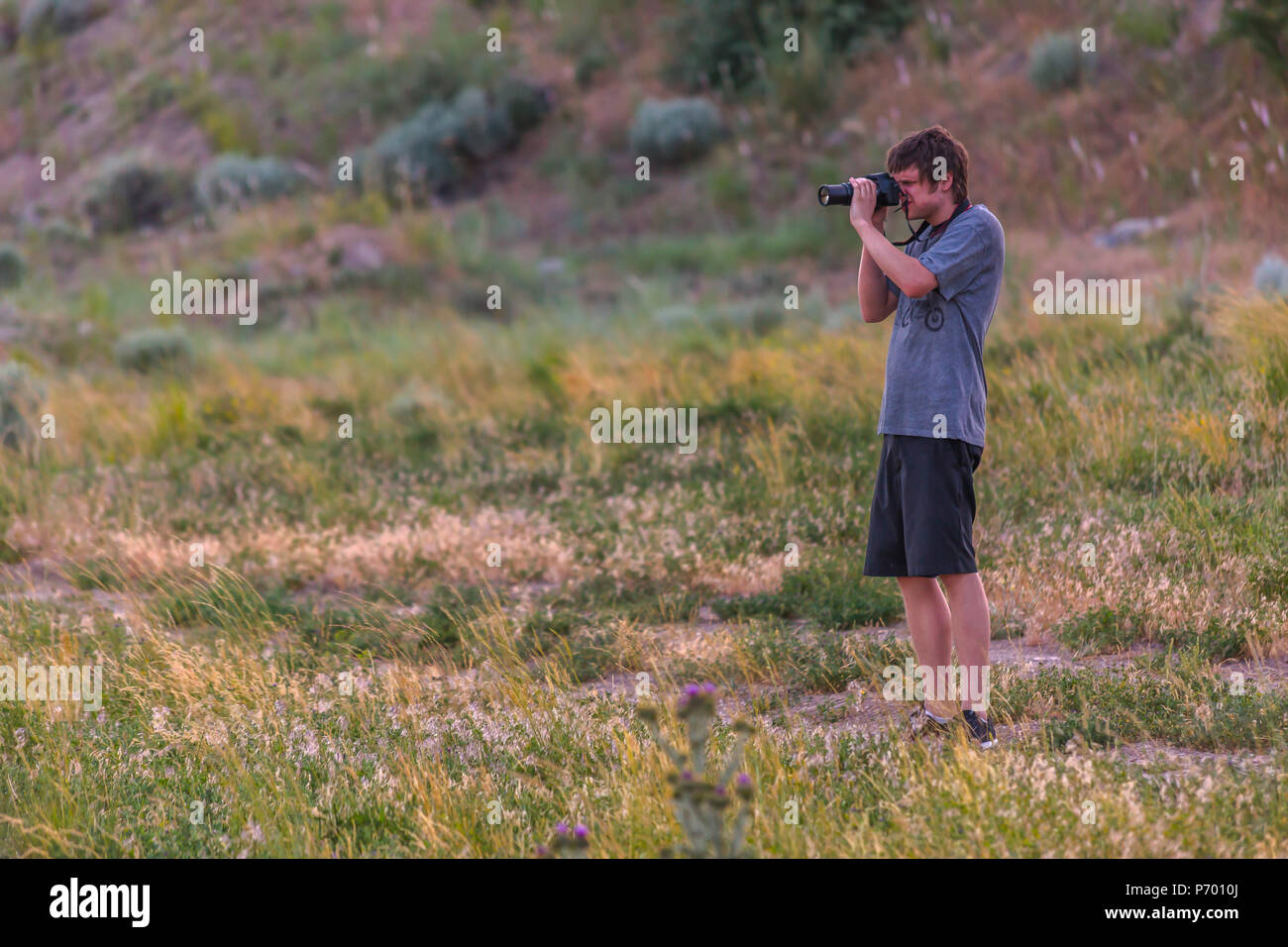 Portrait man taking landscape photos hi-res stock photography and ...