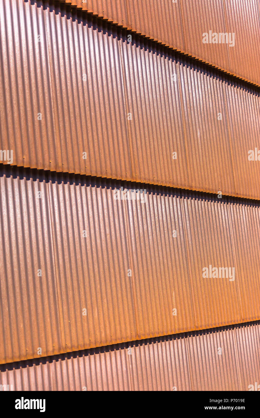 Metal panels on side of building in sun Stock Photo - Alamy