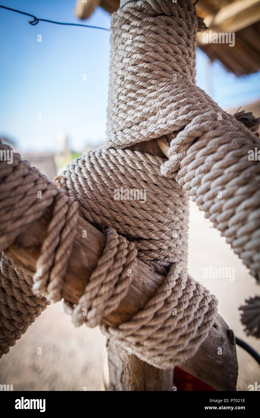 Old rope tied wooden pole hi-res stock photography and images - Alamy