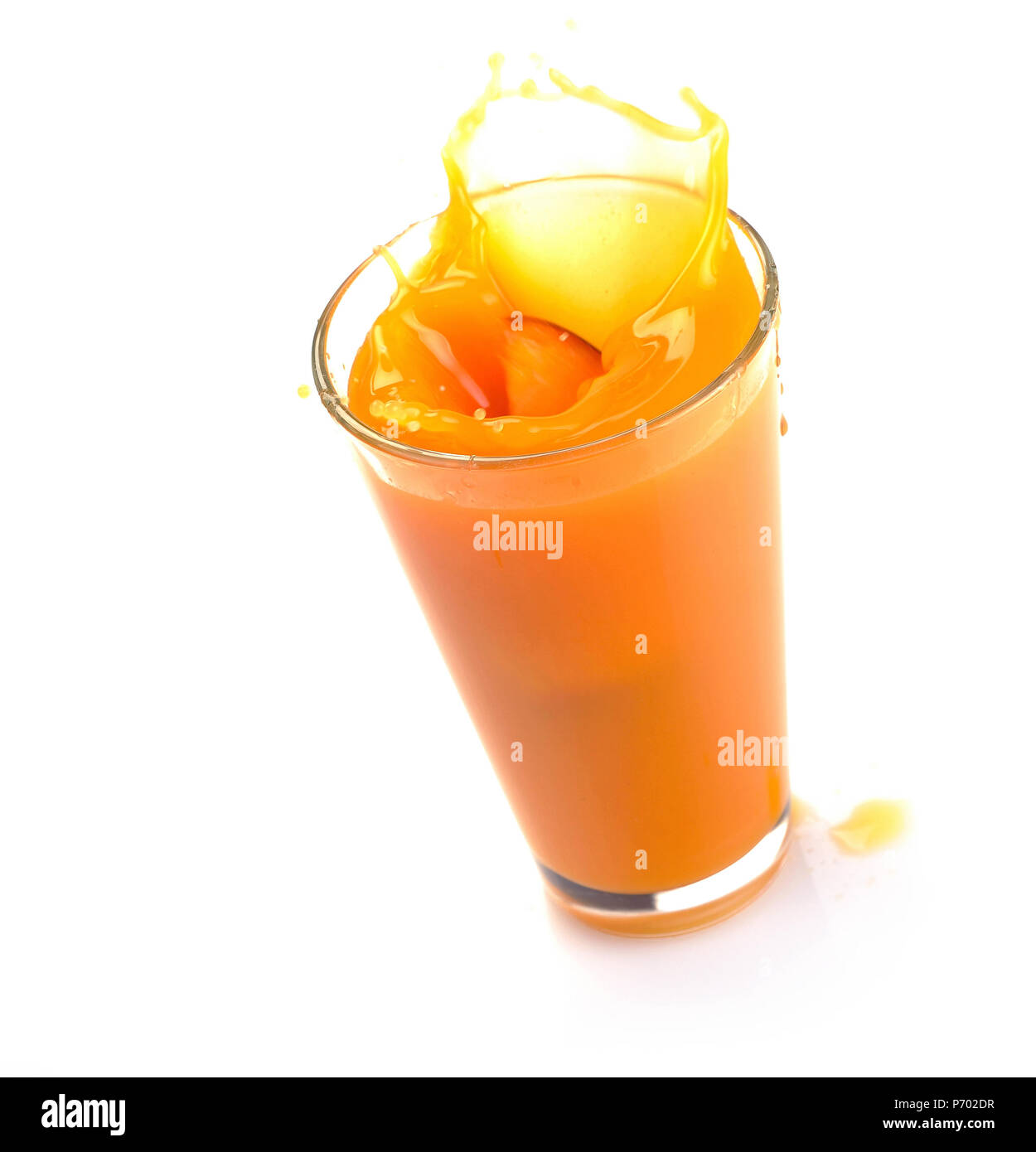 peach juice splash on a white background Stock Photo - Alamy