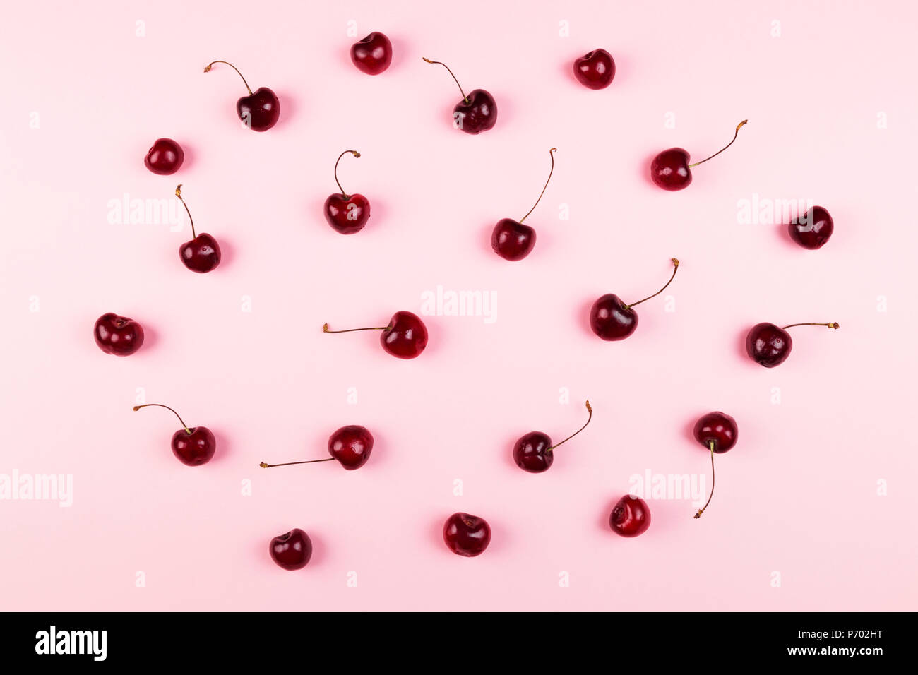 Ripe cherry on a pink background. Top view. Food background Stock Photo ...