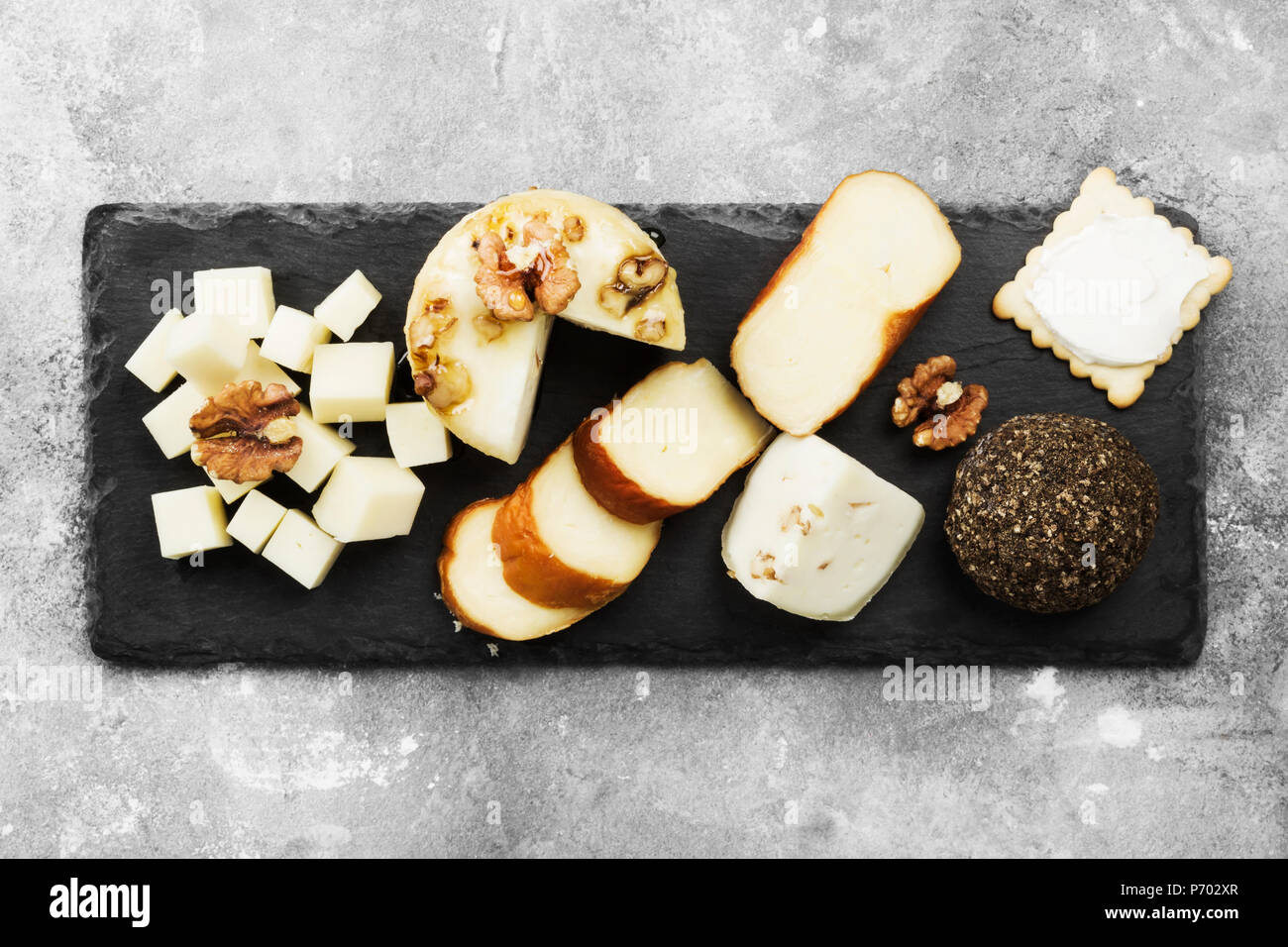 Various types of cheese on a gray background. Top view. Food background ...