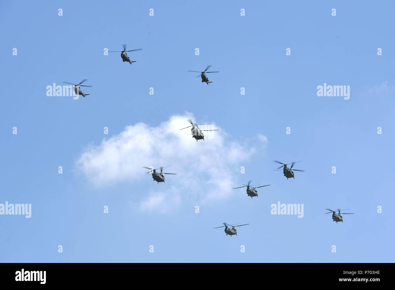 Chinook and Puma helicopters from the Royal Air Force fly over RAF ...