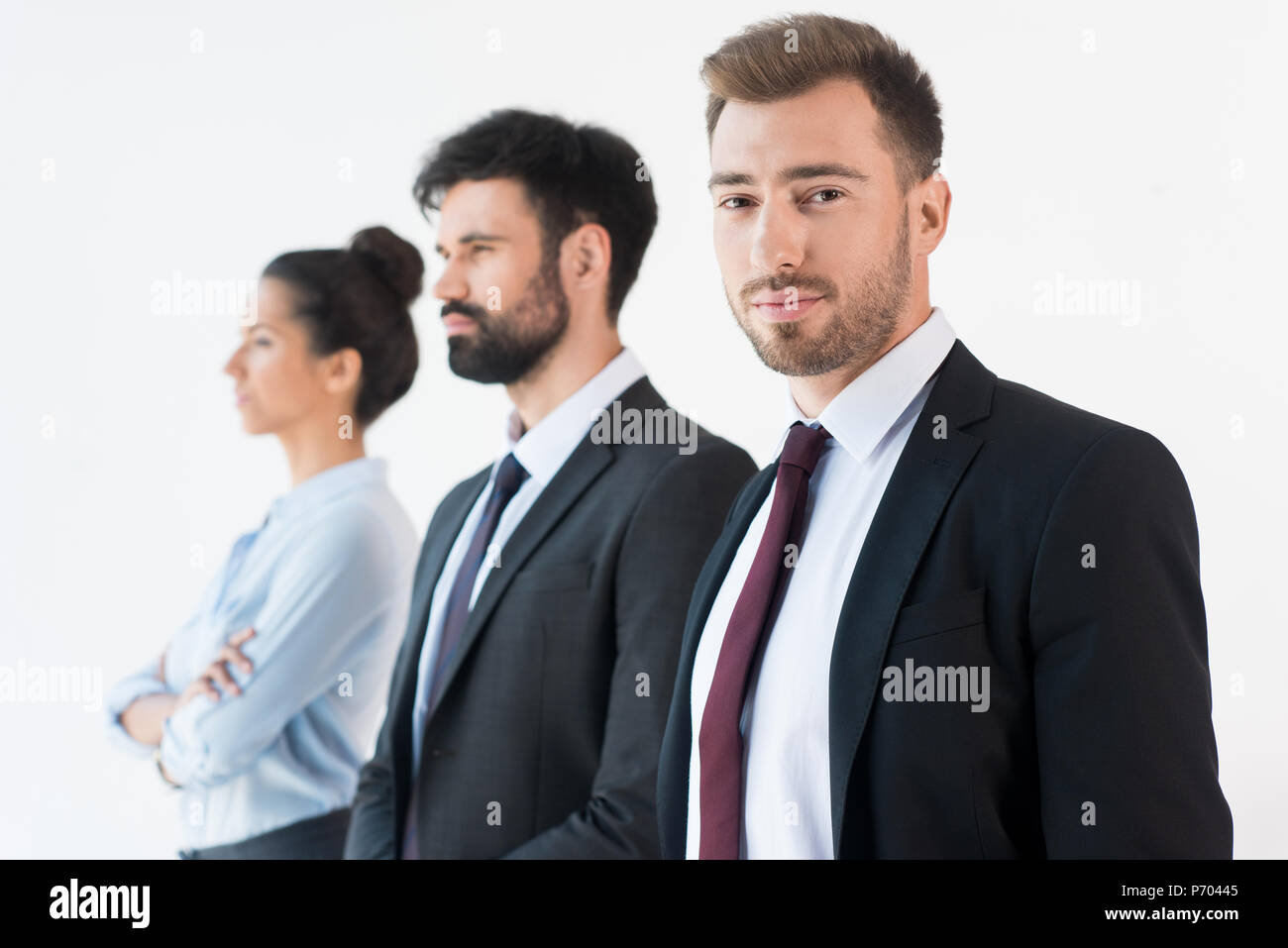 group of confident business people in formal wear isolated on white ...