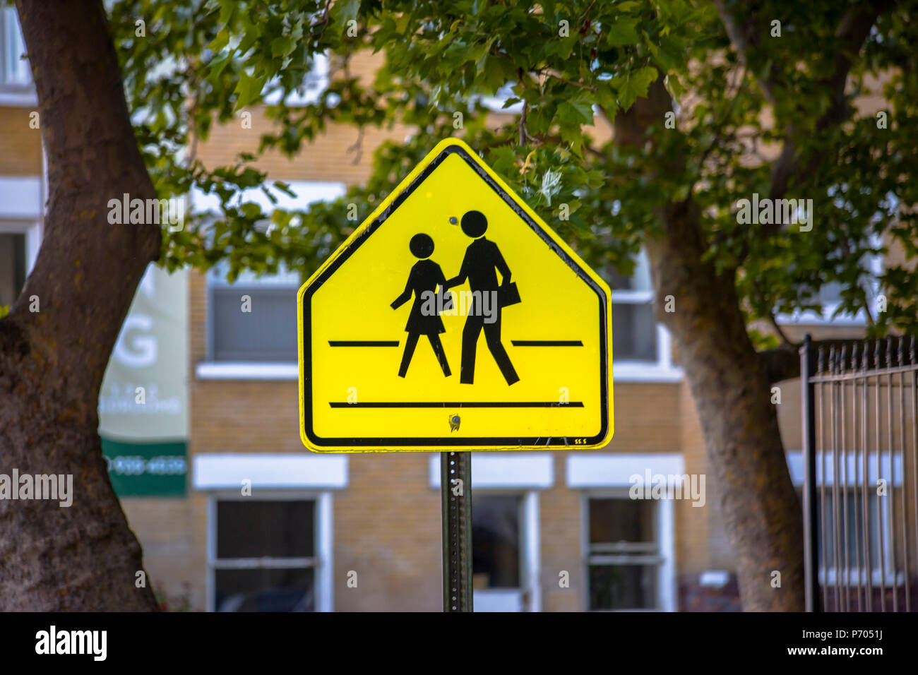 School zone sign in downtown Stock Photo - Alamy