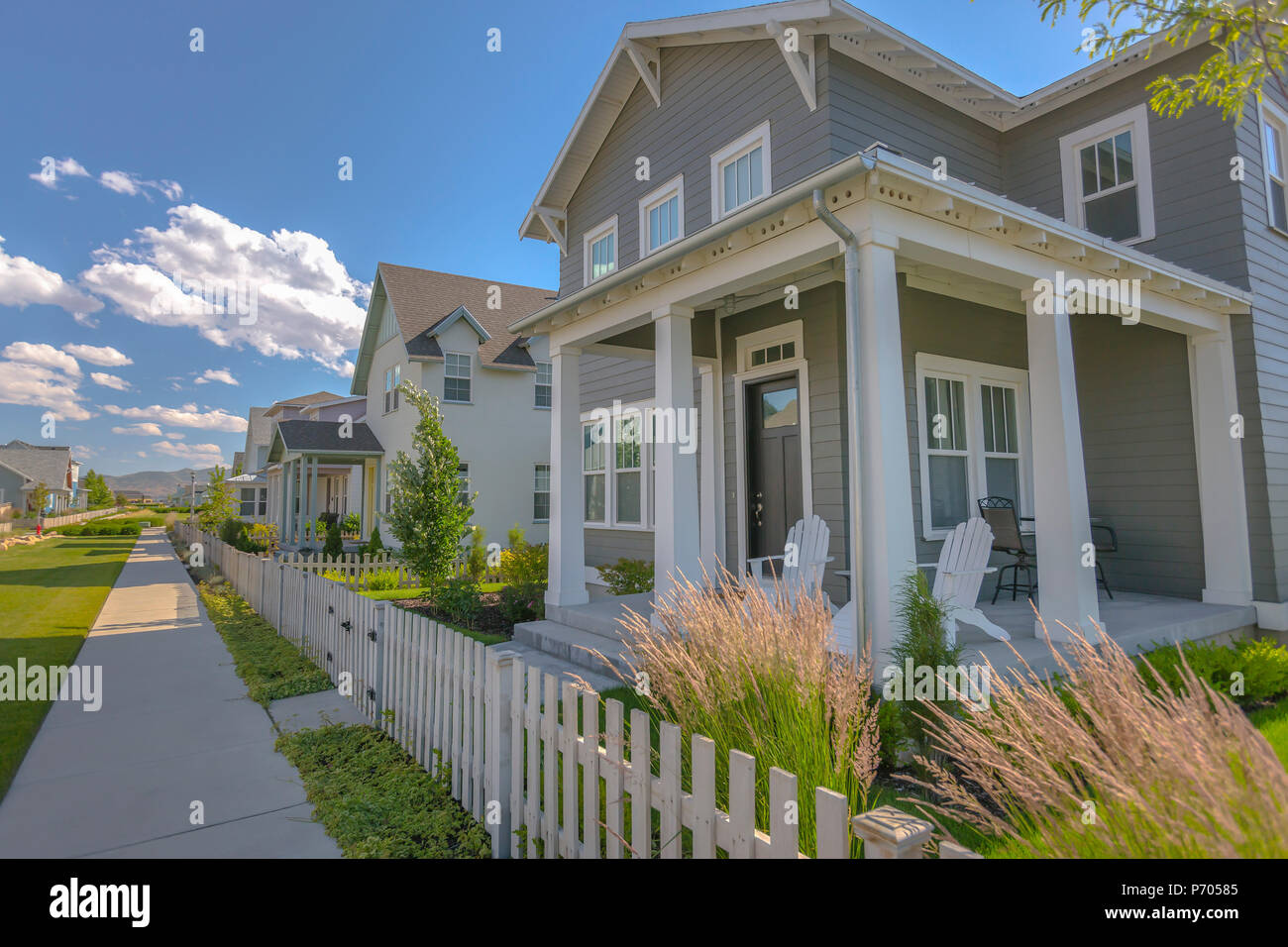 Suburban sidewalk white fence hi-res stock photography and images - Alamy
