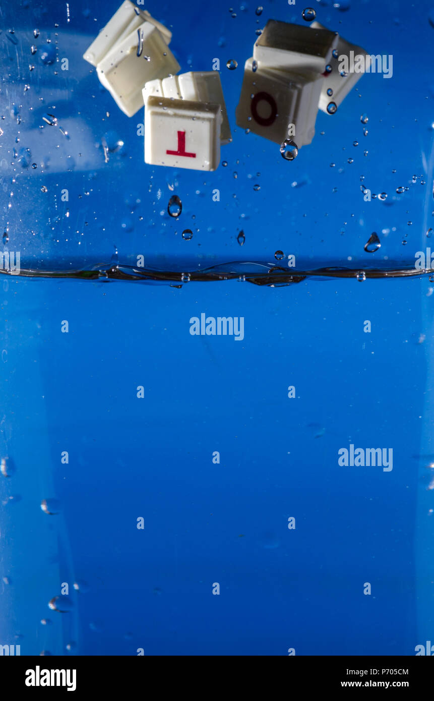 letter falling into the water still life Stock Photo - Alamy