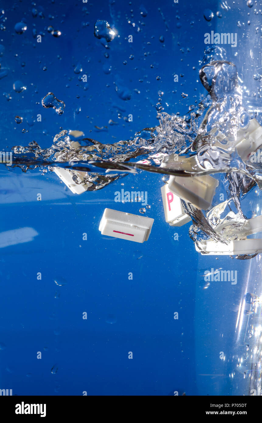 letter falling into the water still life Stock Photo - Alamy
