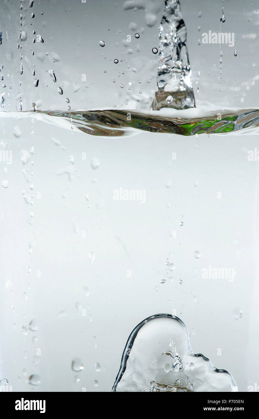 drop and bubble into the water still life Stock Photo - Alamy