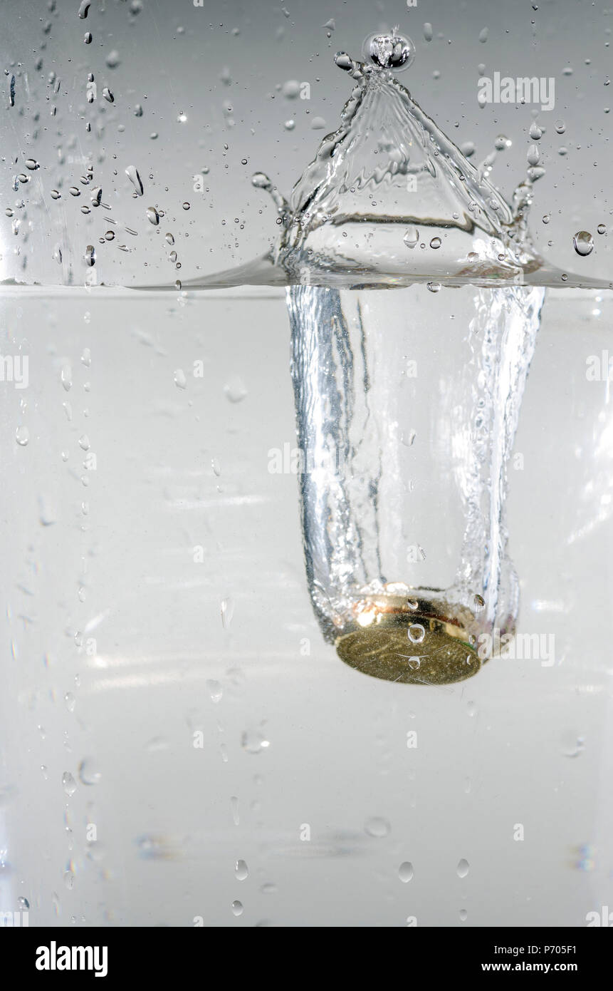 Water drop with coins hi-res stock photography and images - Alamy