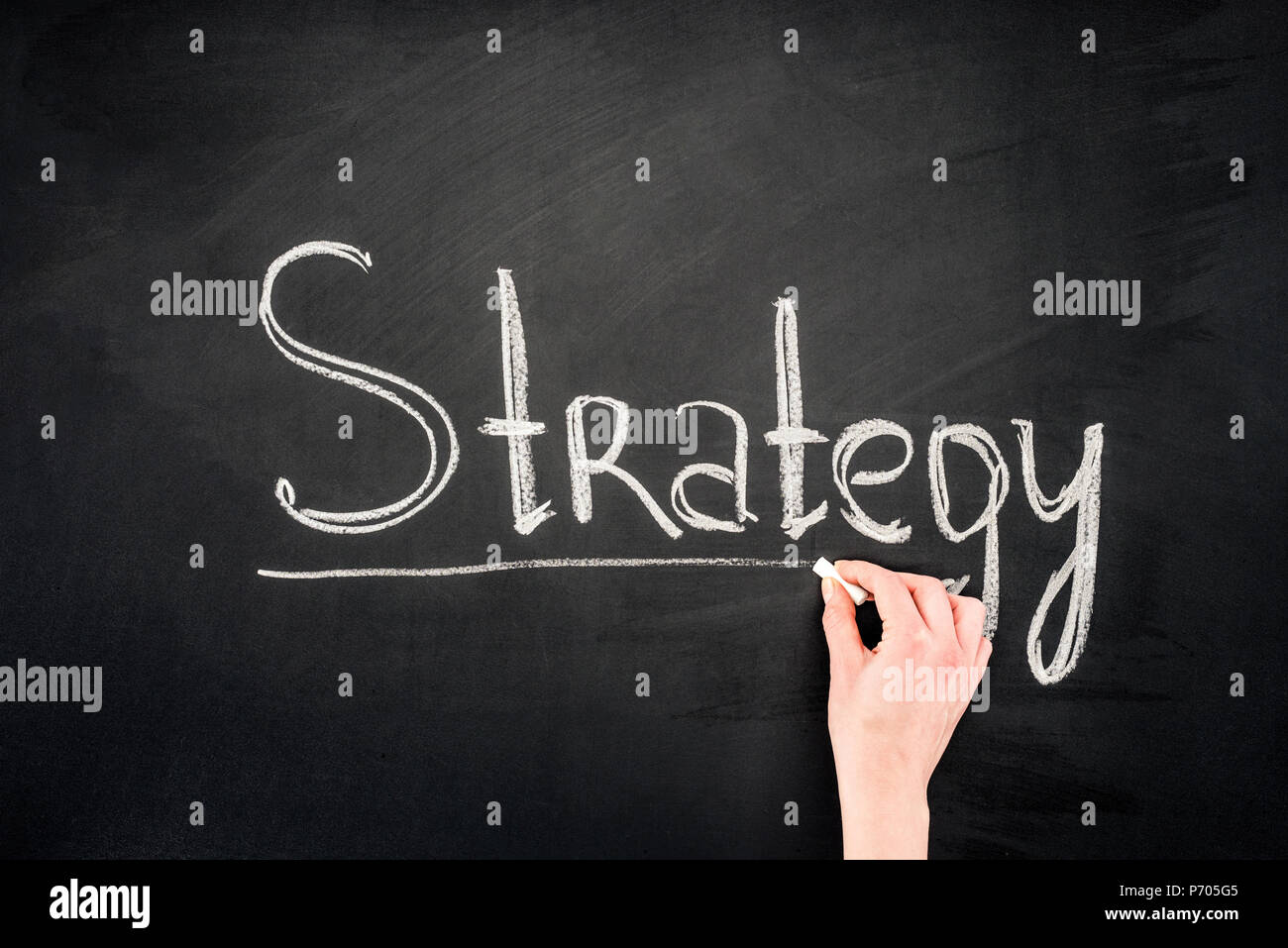 Hand writing Strategy underlined inscription on chalkboard Stock Photo ...