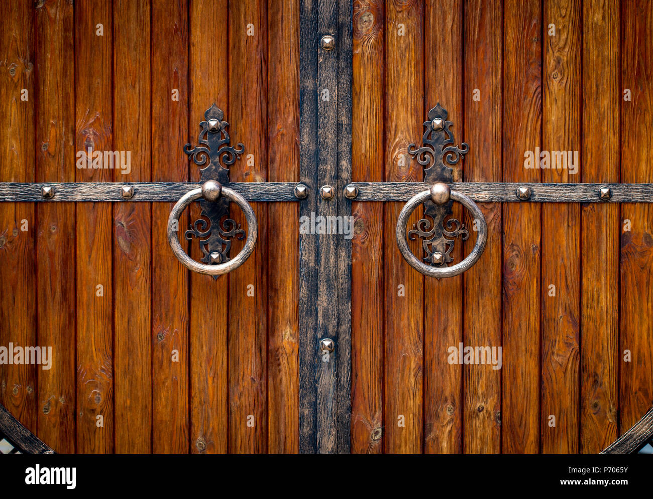 wooden gate with wrought iron elements close up Stock Photo - Alamy