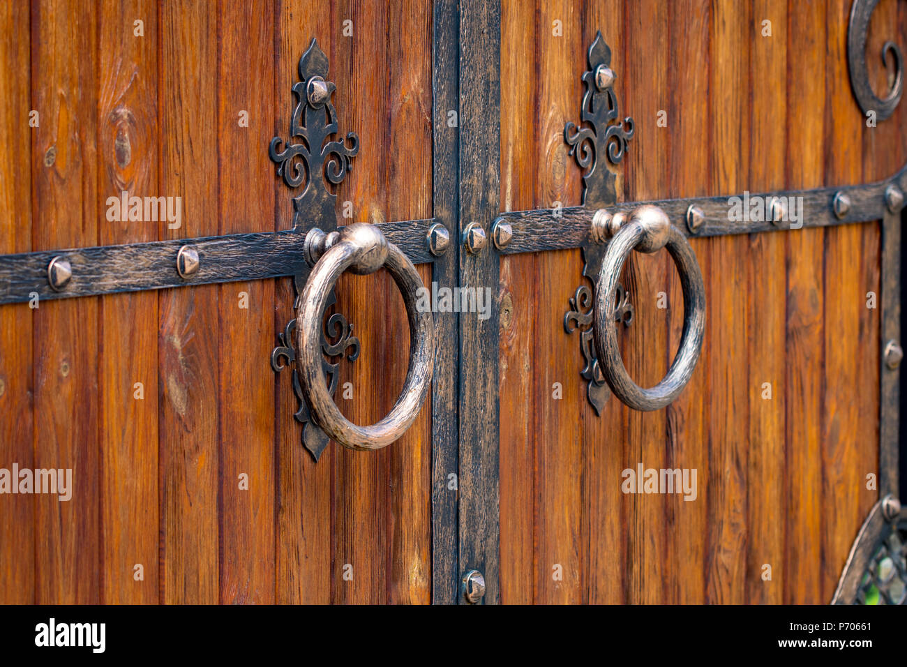 wooden gate with wrought iron elements close up Stock Photo - Alamy