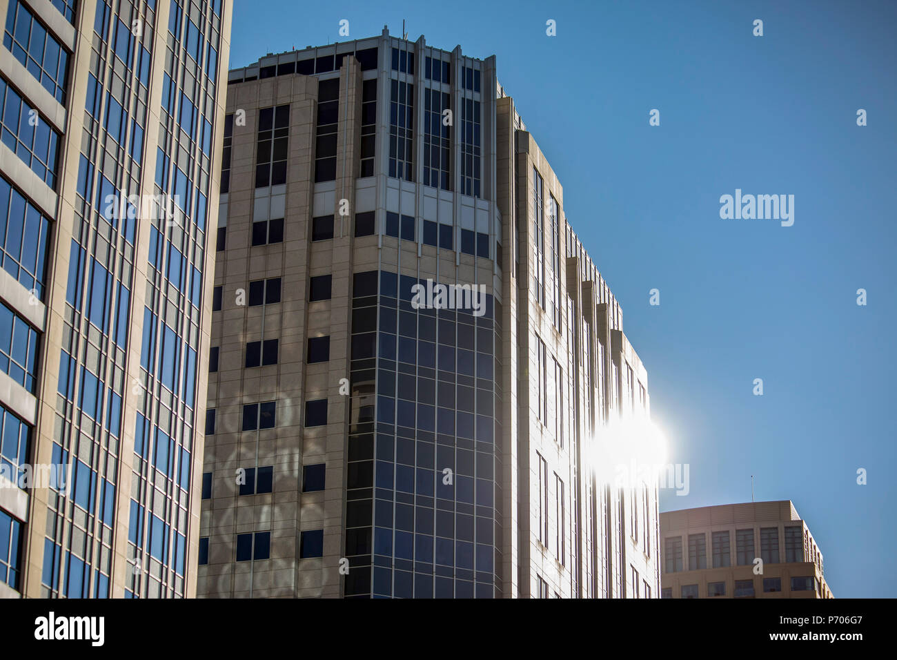 Sun reflection on tall buildings downtown Stock Photo - Alamy