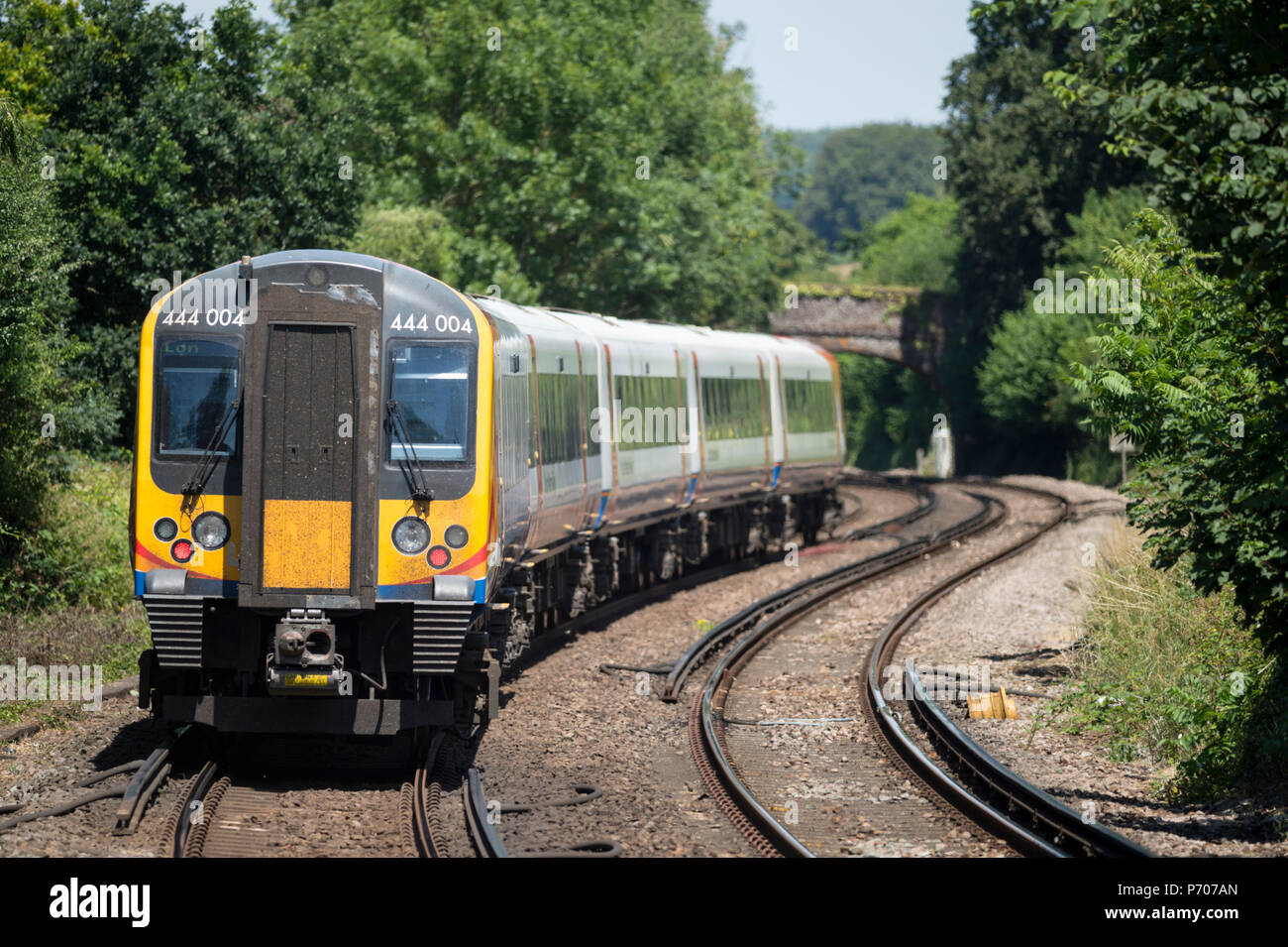South Western railway 444 Class commuter train northbound between ...