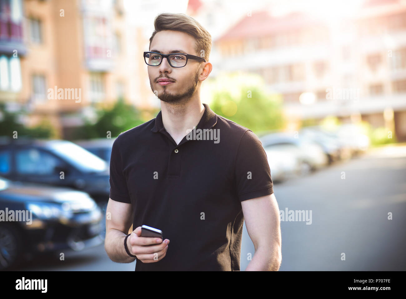 Handsome nice man standing hi-res stock photography and images - Alamy