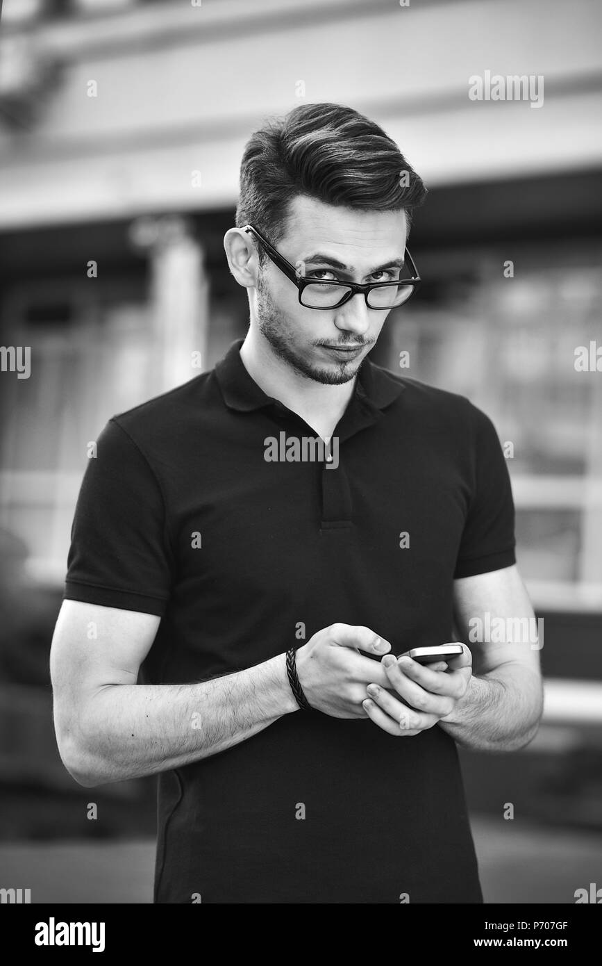 Handsome guy standing Black and White Stock Photos & Images - Alamy