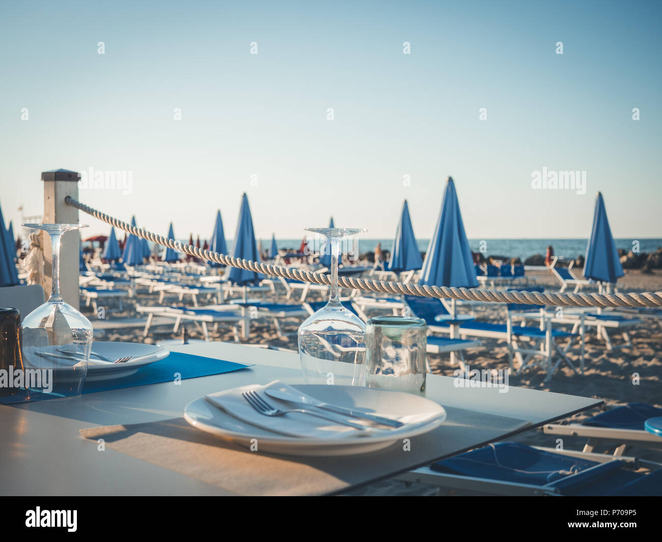 restaurant on the beach on sunset Stock Photo - Alamy