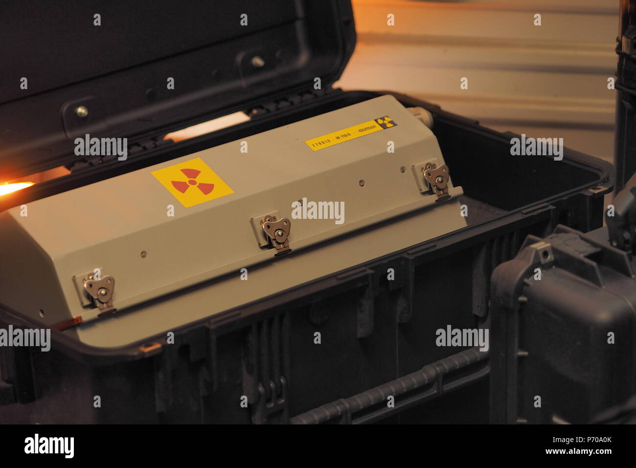 Box shaped metal container with radiation warning in a military grade ...
