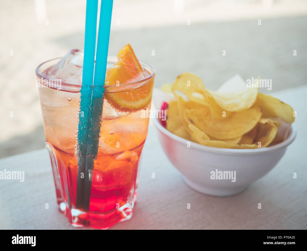 Summer appetizer with spritz cocktail and chips on the beach Stock ...